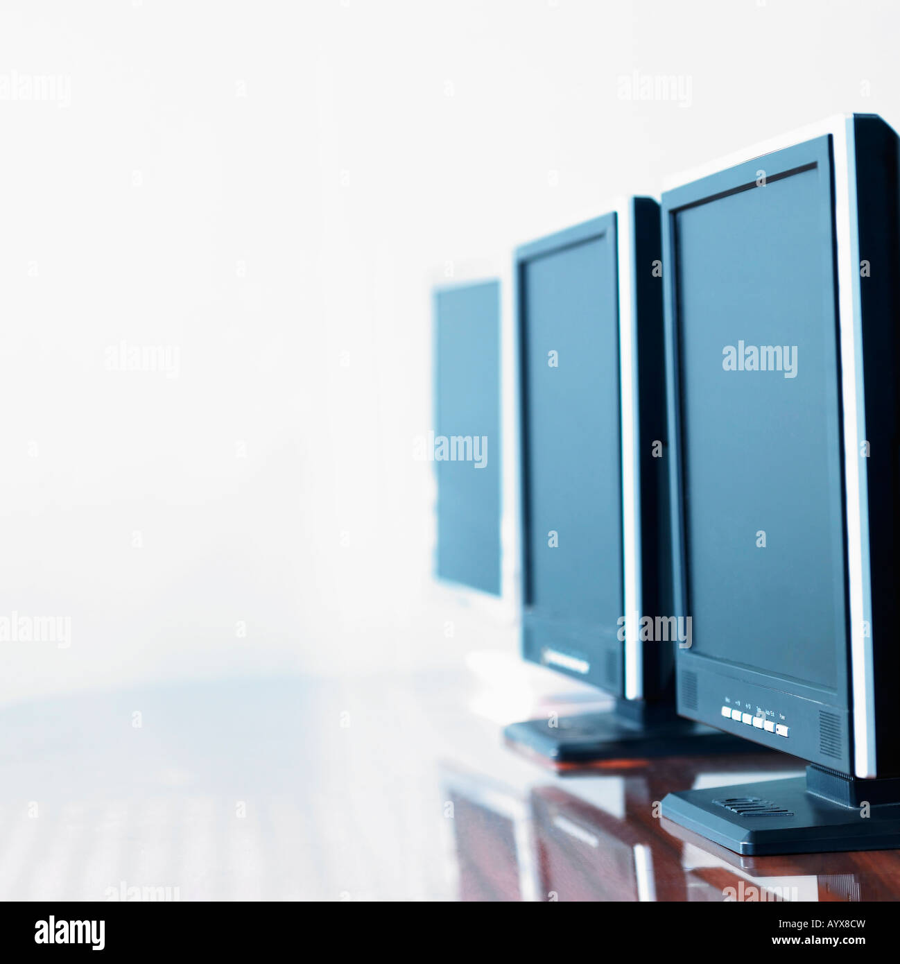 arrayed monitors on white background Stock Photo - Alamy
