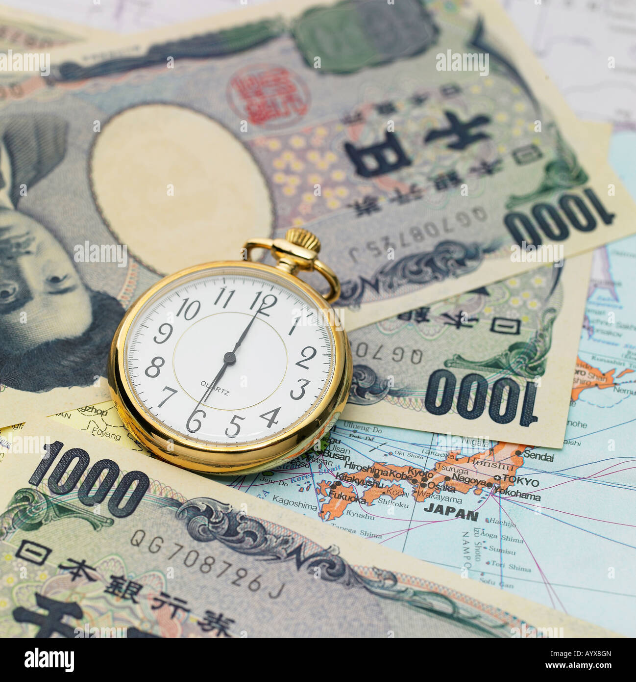 alarm clock on the money and map of Japan Stock Photo - Alamy
