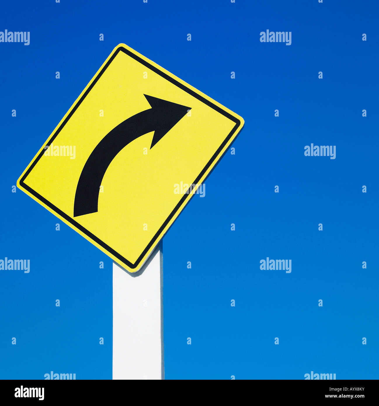 yellow arrow sign in the blue sky Stock Photo - Alamy