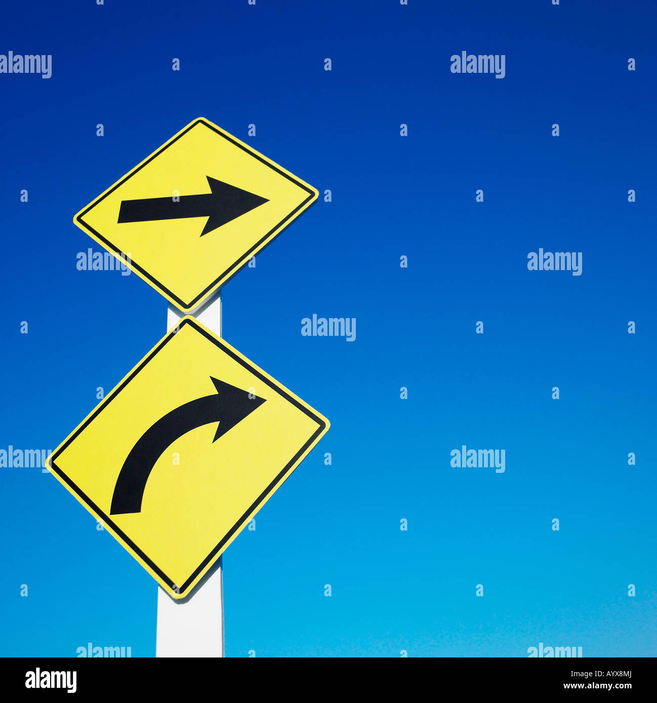 yellow arrow sign in the blue sky Stock Photo - Alamy