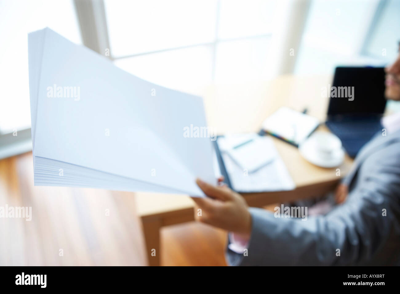 man handing out documents Stock Photo - Alamy