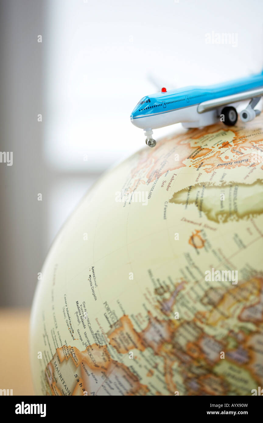 miniature airplane on the globe Stock Photo - Alamy