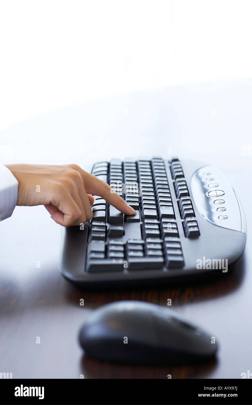 hand typing on keyboard Stock Photo - Alamy