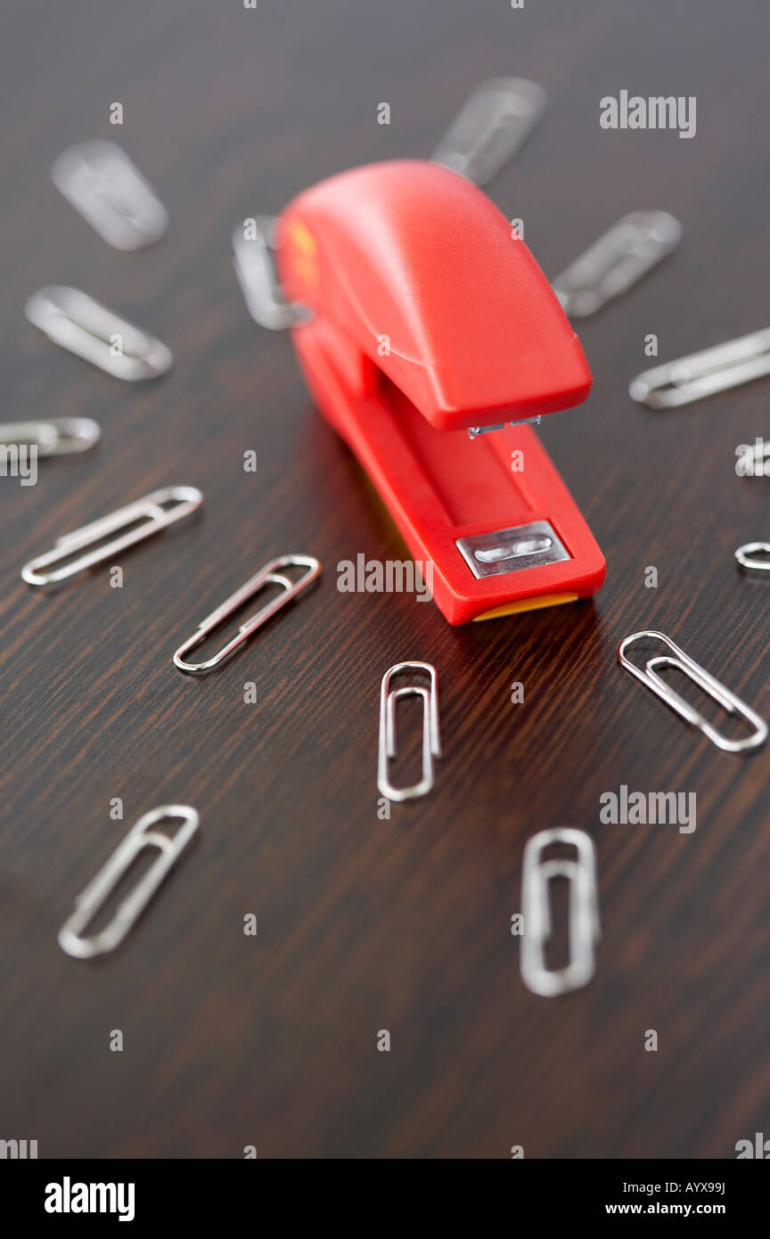 clips around the red stapler Stock Photo - Alamy