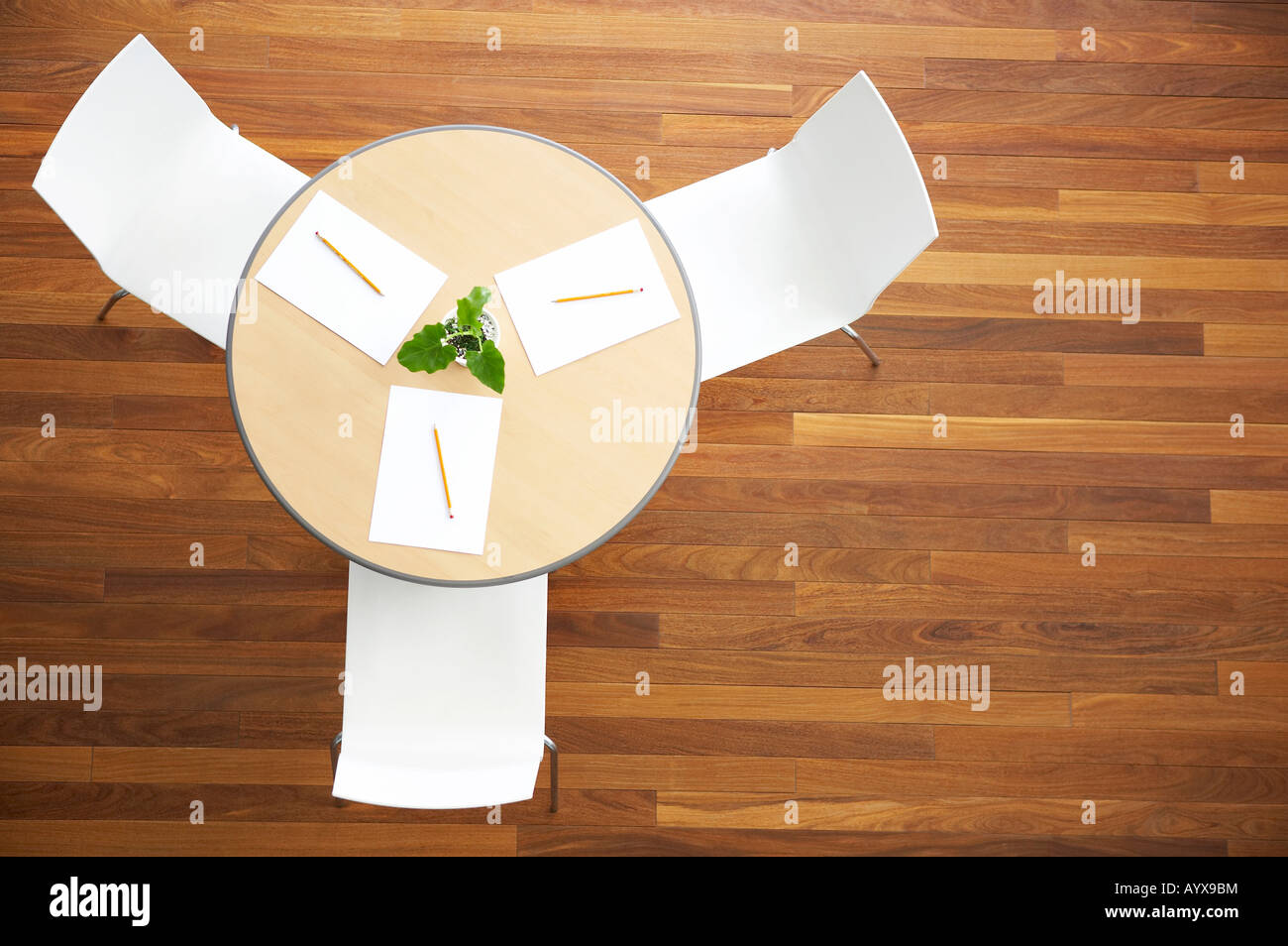 document on the round table and chair at high angle Stock Photo - Alamy