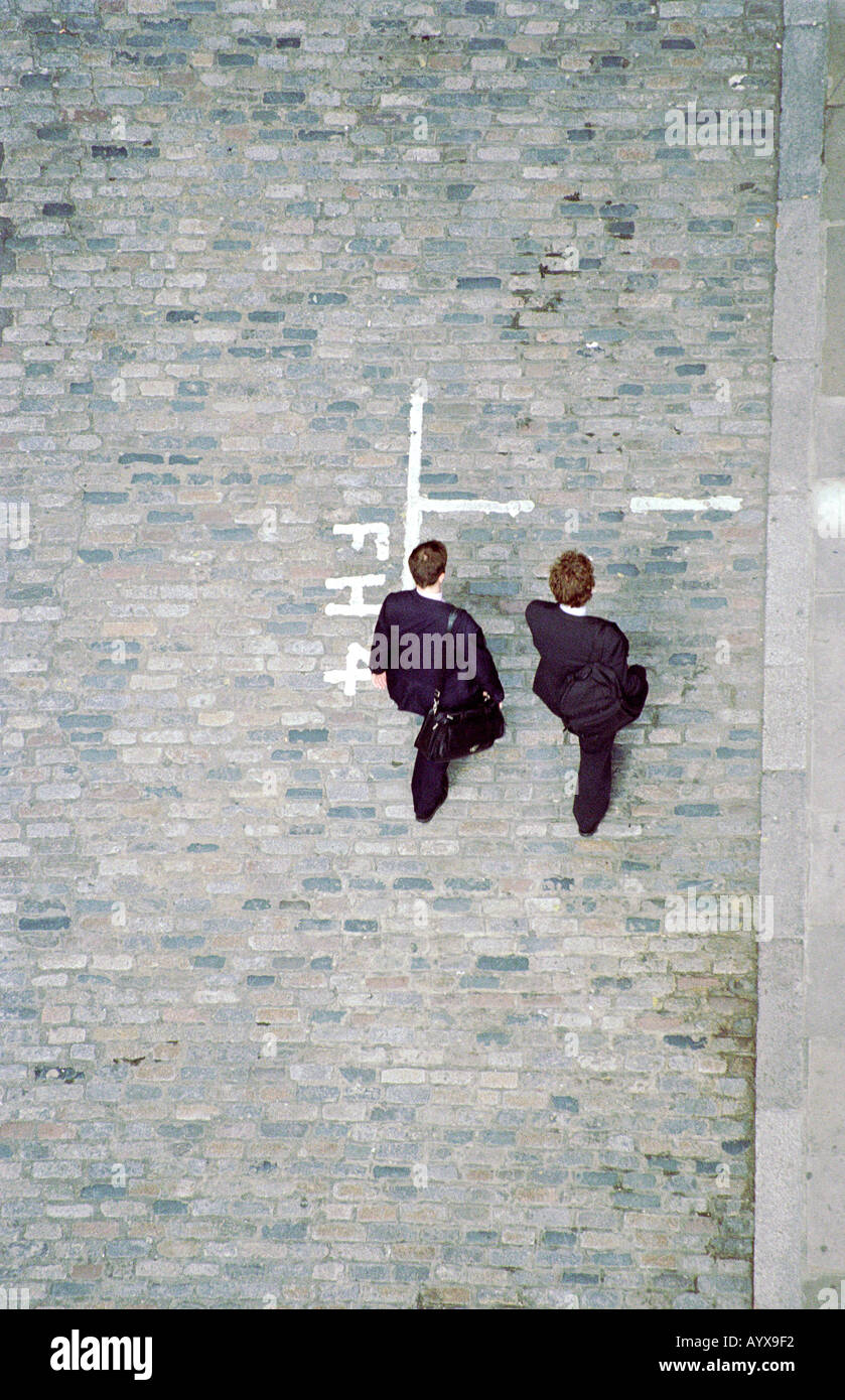 Overhead View of Two Men Walking Down a Street Stock Photo - Alamy