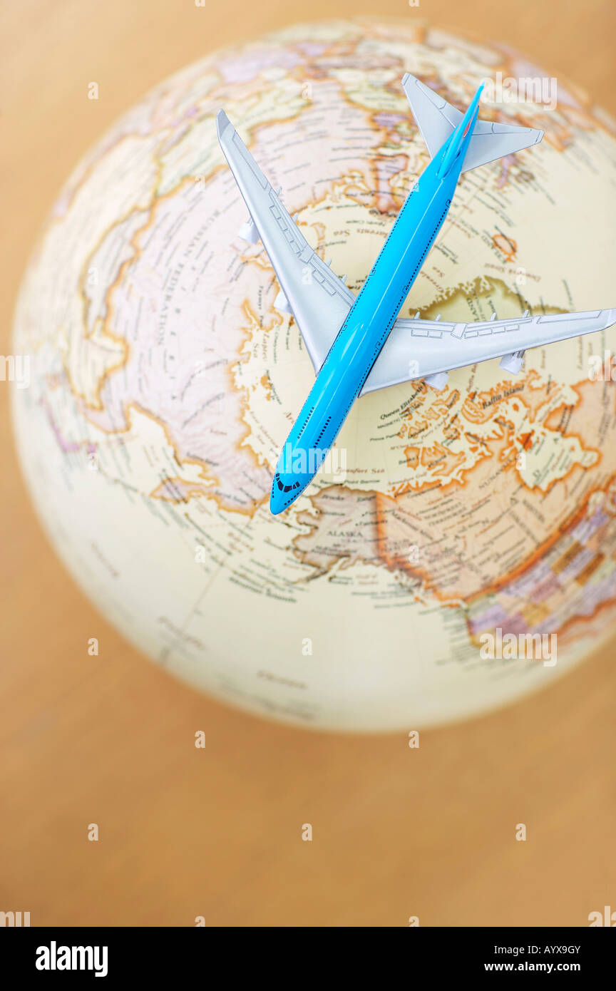 miniature airplane on the globe Stock Photo - Alamy