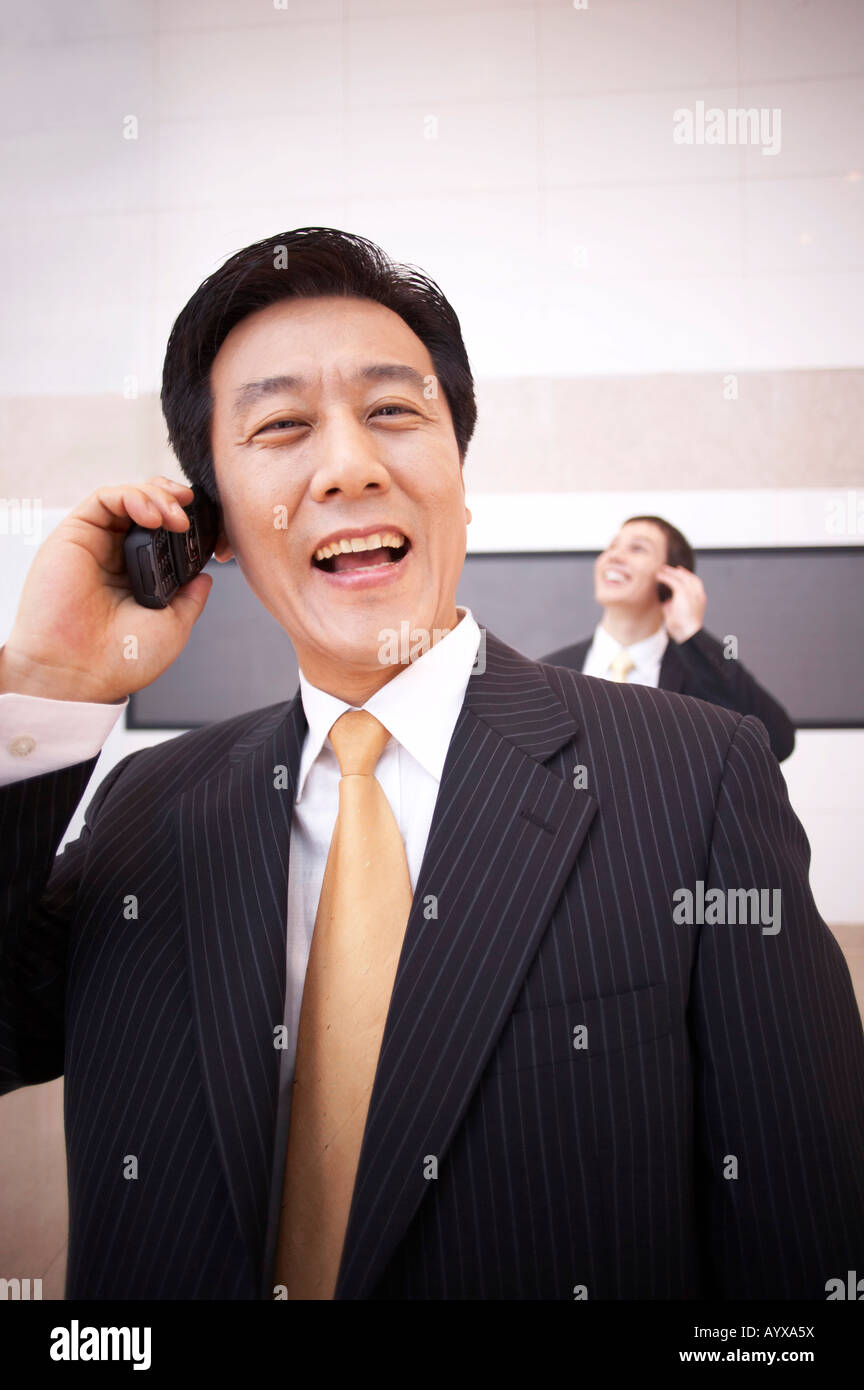 man with smile while chatting with the cellular phone Stock Photo - Alamy