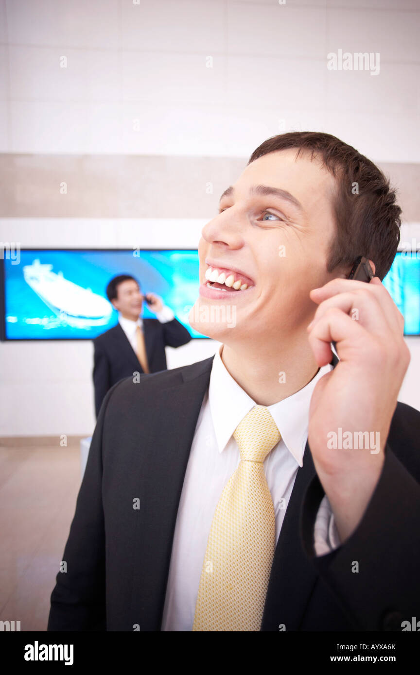 man with smile while chatting with the cellular phone Stock Photo - Alamy