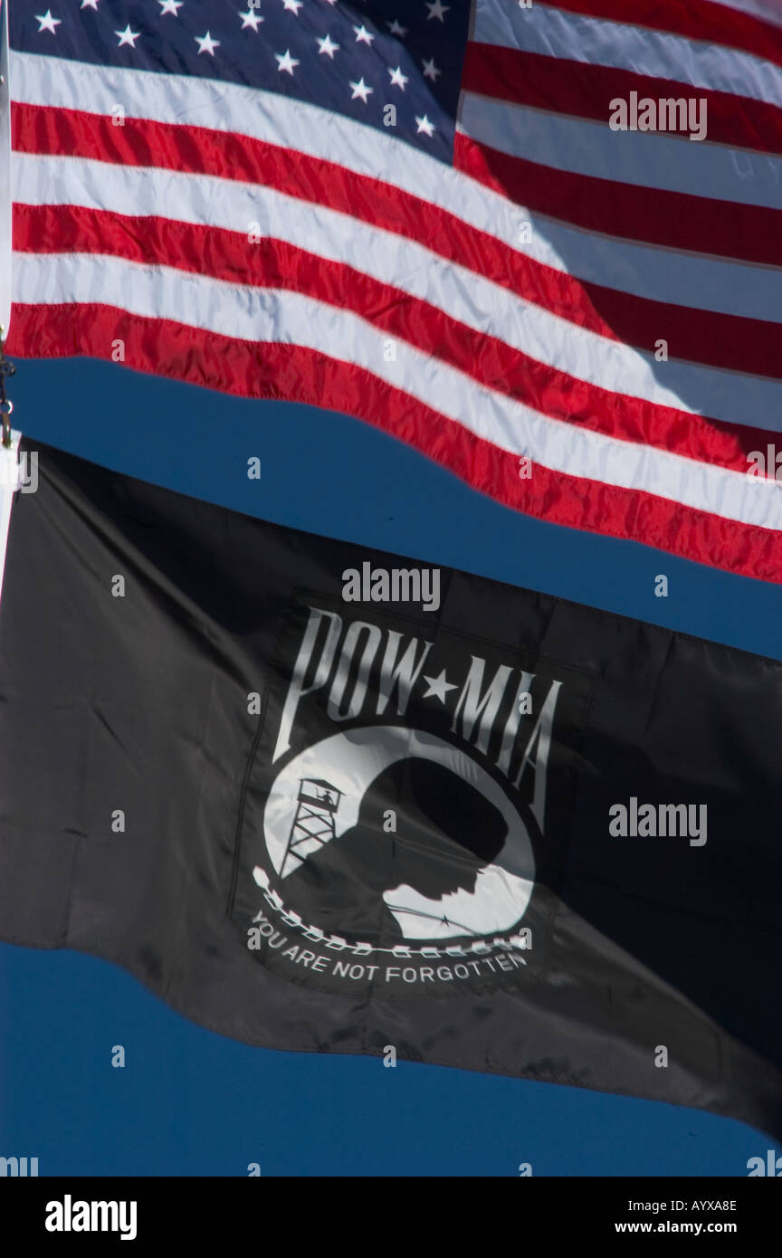US American flag and Vietnam Missing in Action Flag flying in breeze on ...