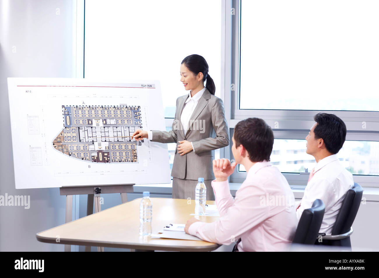 woman explaining document and man listening explanation Stock Photo - Alamy