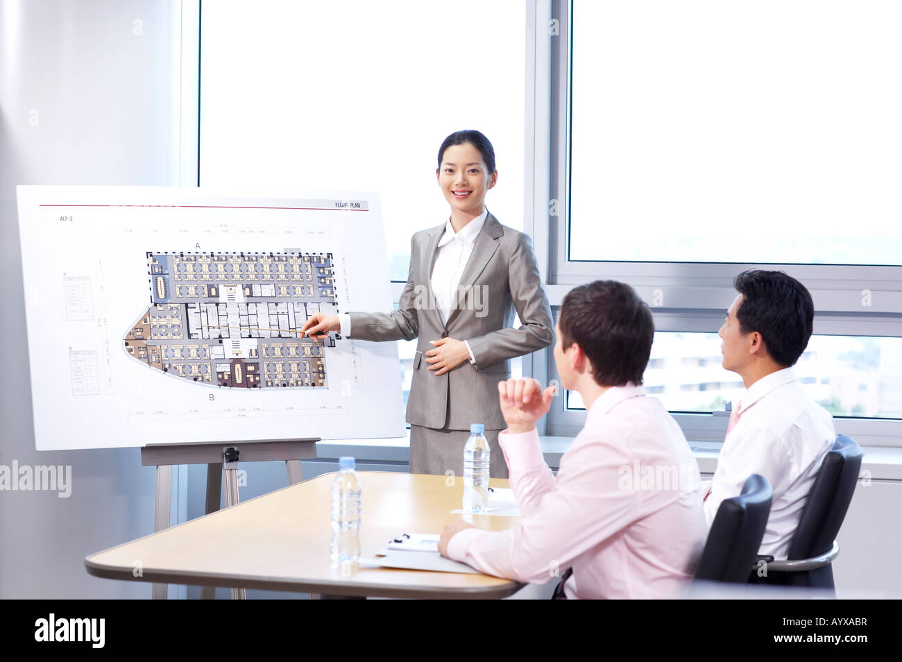 woman explaining document and man listening explanation Stock Photo - Alamy