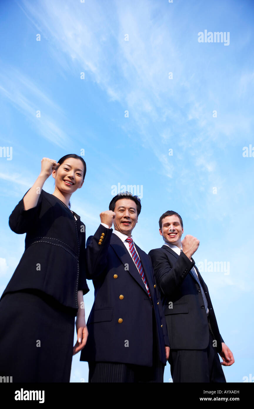 cheering men with blue sky background Stock Photo - Alamy