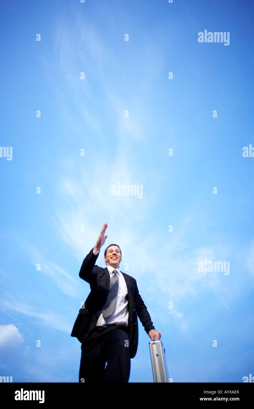 running man with blue sky background Stock Photo - Alamy