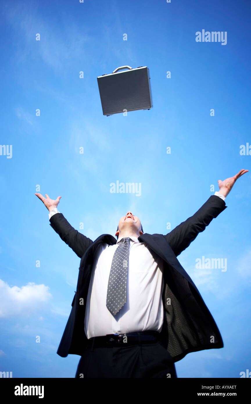man throwing bag with blue sky background Stock Photo - Alamy