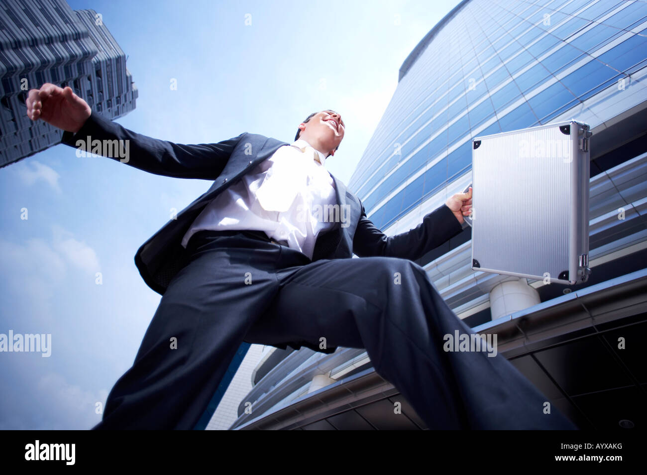 man running in front of the building at low angle Stock Photo - Alamy