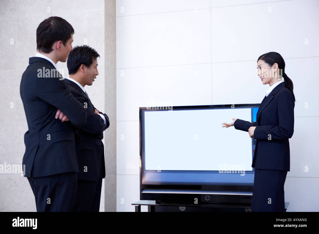 woman poing at screen for explanation and watching people Stock Photo ...