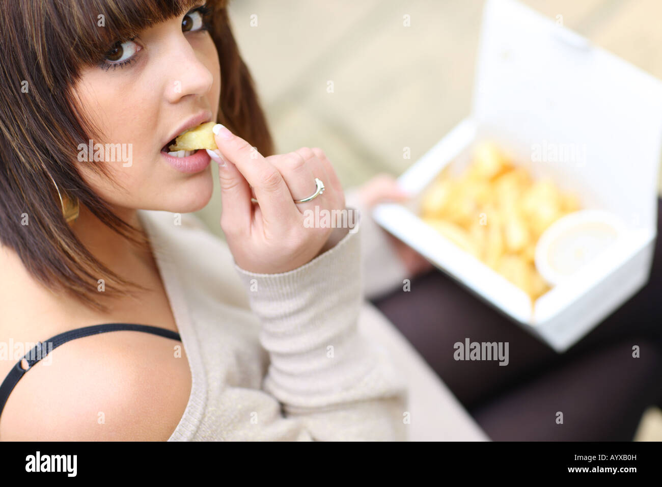 Teenage Girl Eating Chips Model Released Stock Photo - Alamy