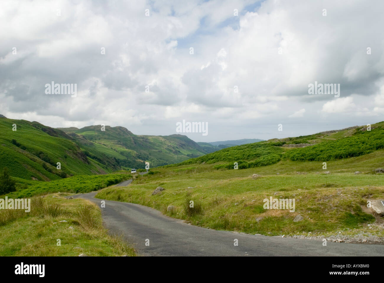 Winding road in the Scottish highlands to a remote and rural location ...