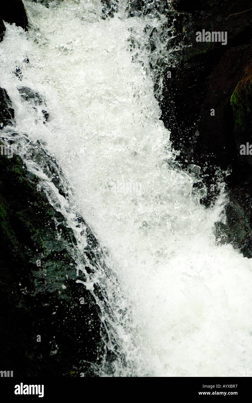 Waterfall in full spate taken with a fast shutter speed to freeze the ...
