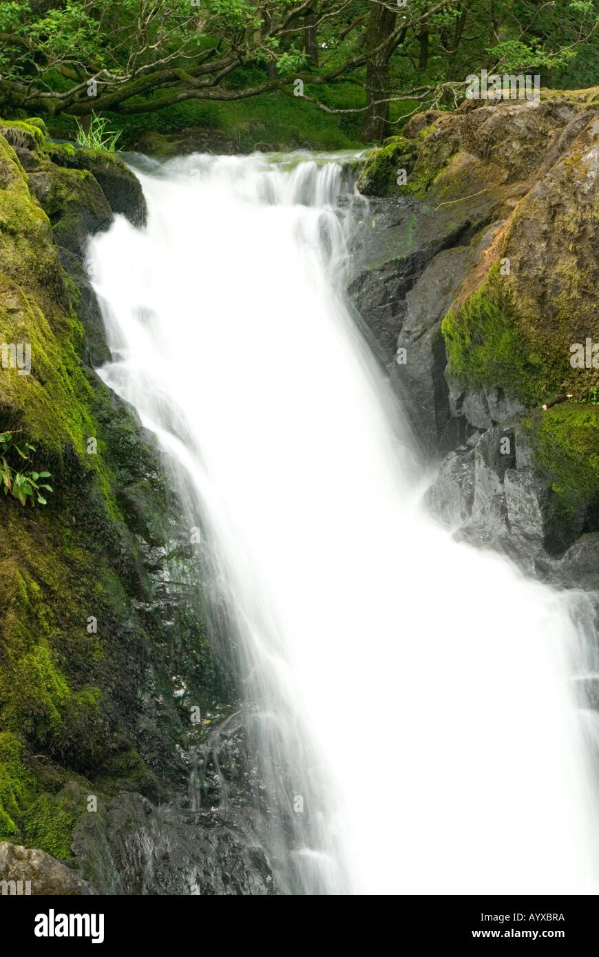 Waterfall in full spate showing the power of the water to carve the ...
