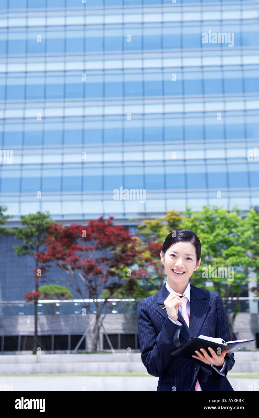a woman taking a note in outdoor Stock Photo - Alamy