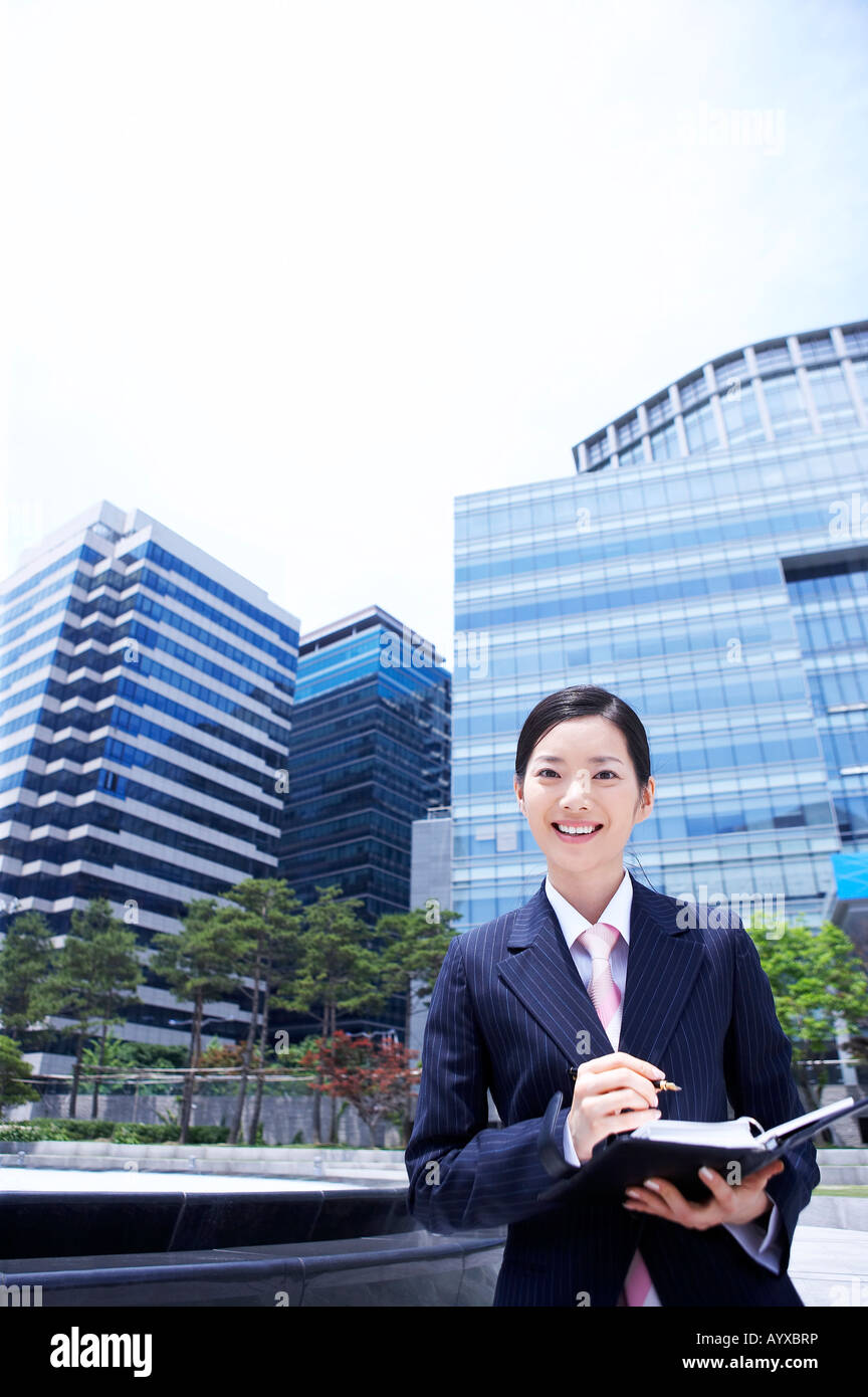 a woman taking a note in outdoor Stock Photo - Alamy