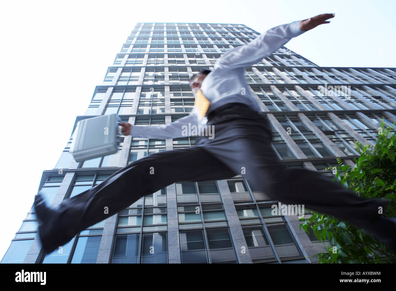 a man running over with holding briefcase Stock Photo - Alamy