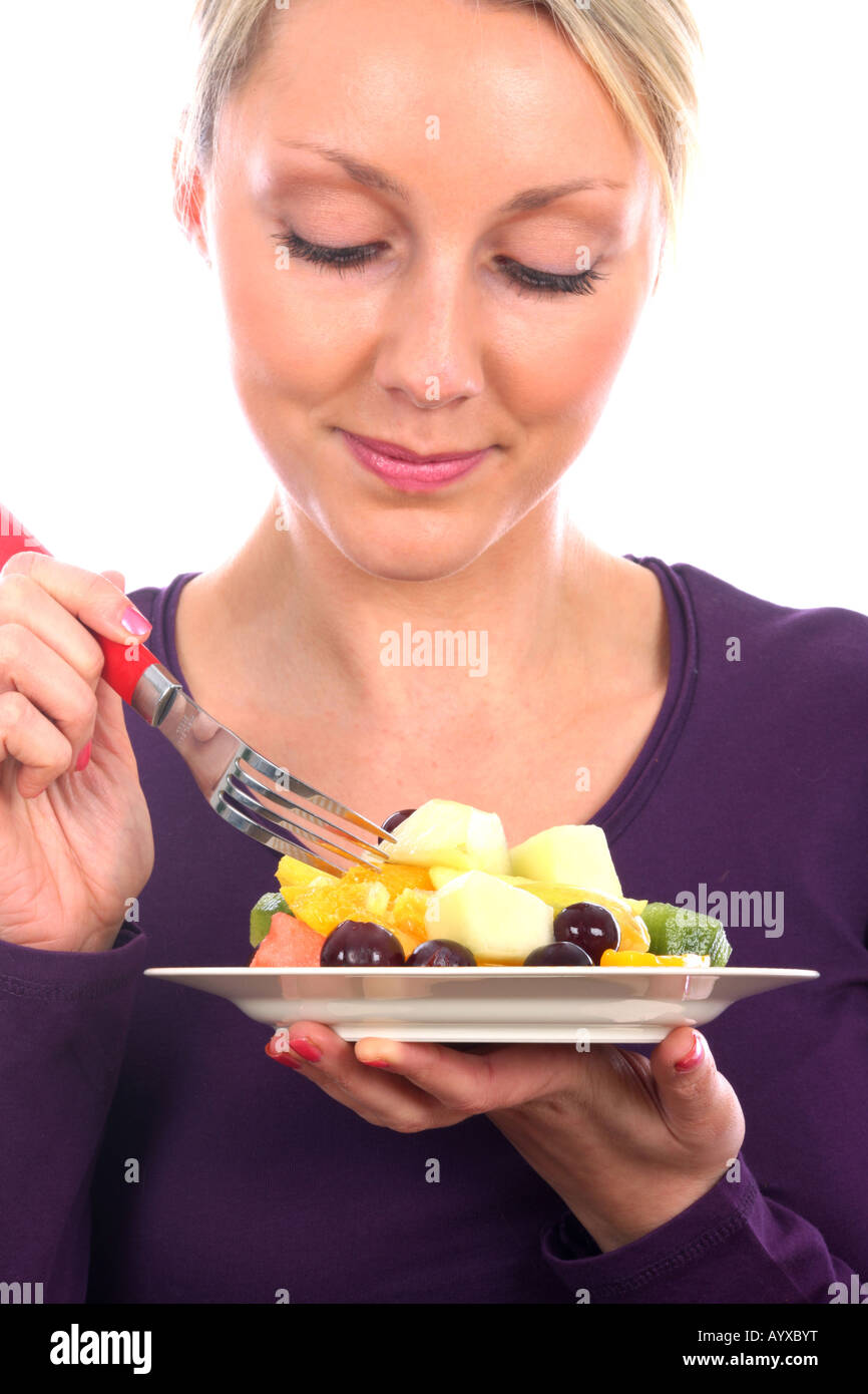 Young Woman Eating Fruit Salad Model Released Stock Photo - Alamy