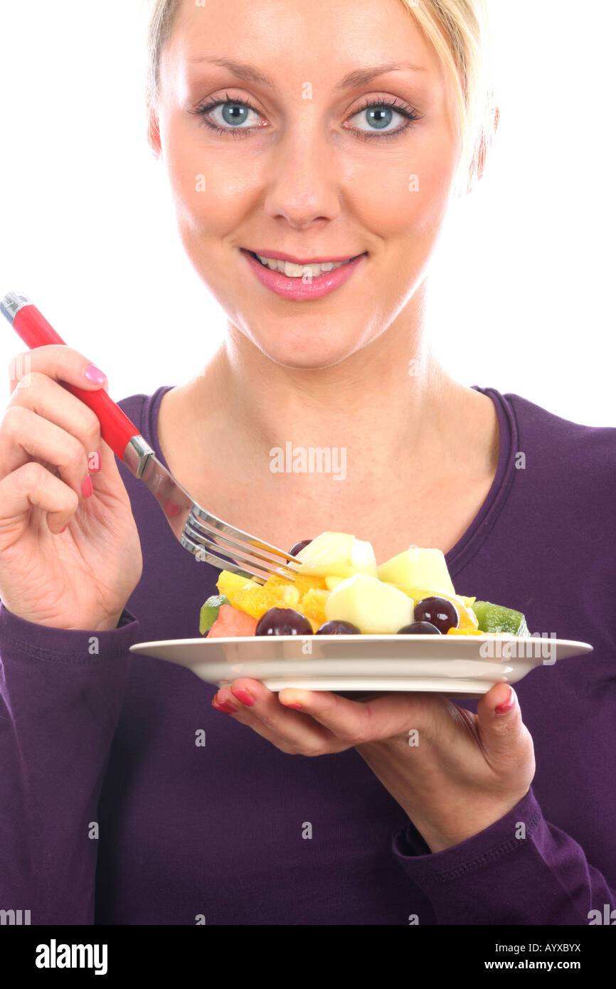 Young Woman Eating Fruit Salad Model Released Stock Photo - Alamy
