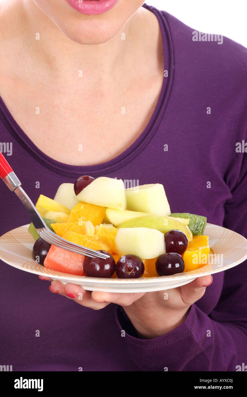 Young Woman Eating Fruit Salad Model Released Stock Photo - Alamy