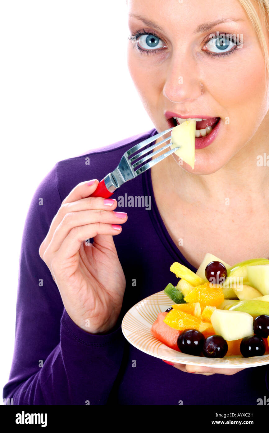 Young Woman Eating Fruit Salad Model Released Stock Photo - Alamy