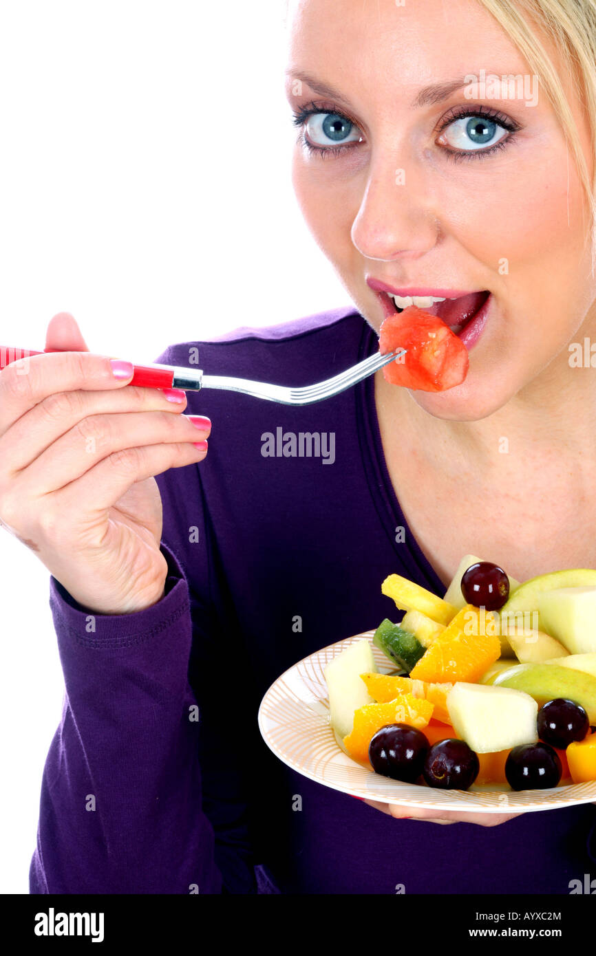 Young Woman Eating Fruit Salad Model Released Stock Photo - Alamy