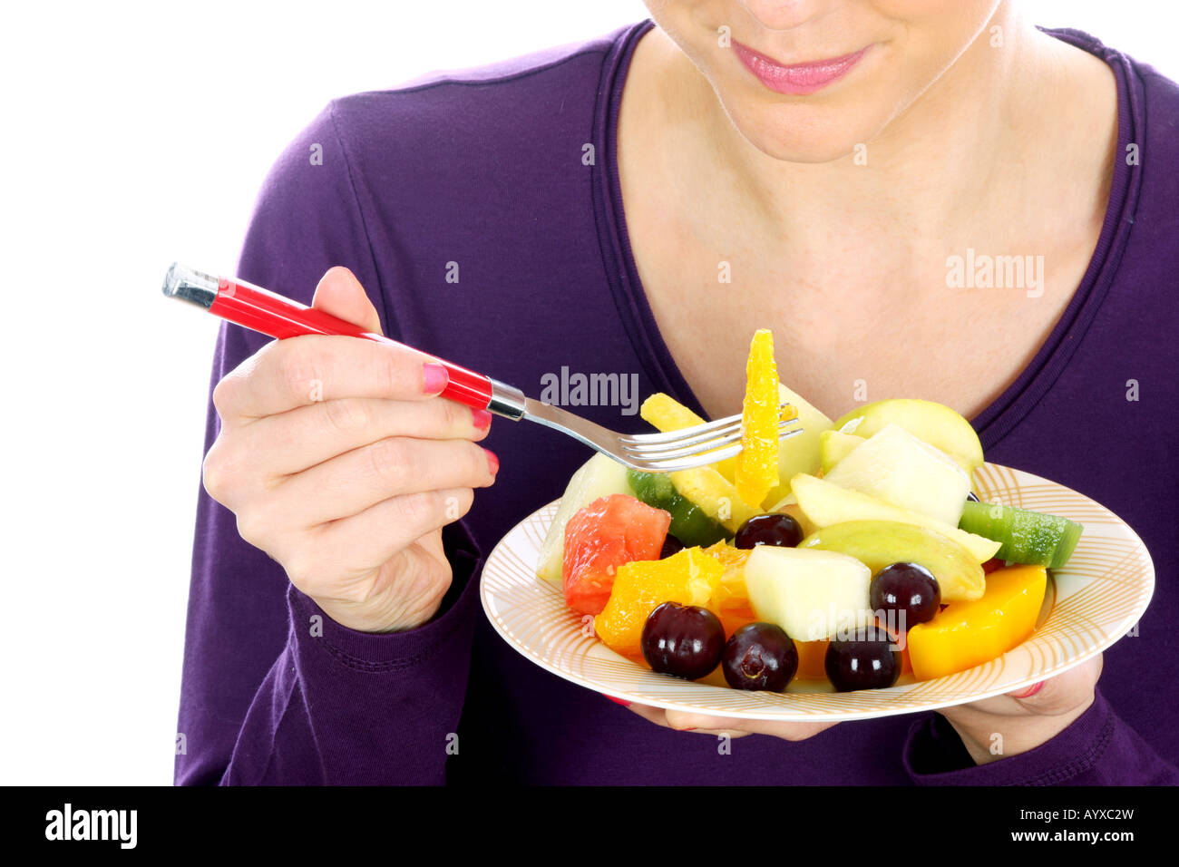 Young Woman Eating Fruit Salad Model Released Stock Photo - Alamy