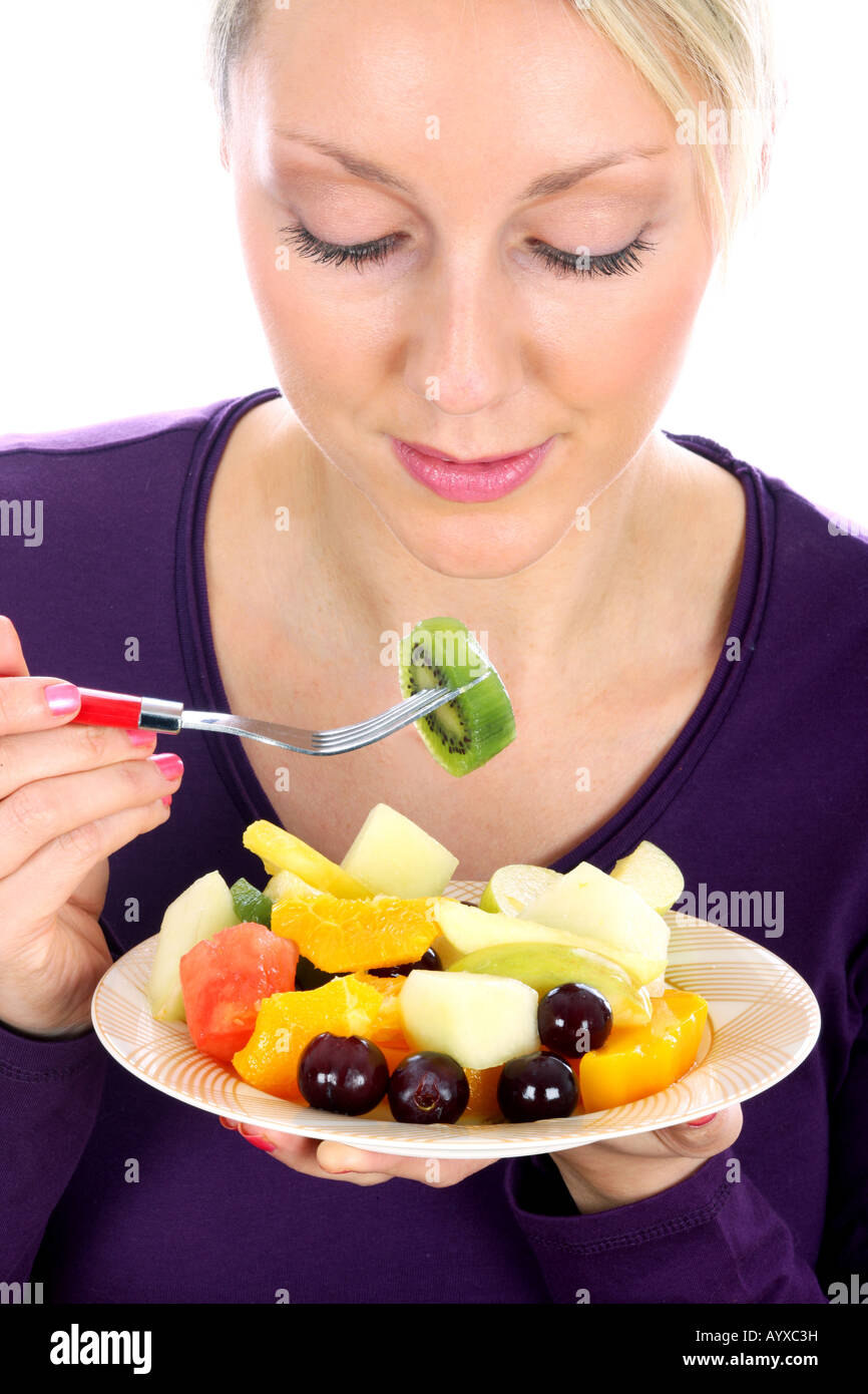 Young Woman Eating Fruit Salad Model Released Stock Photo - Alamy
