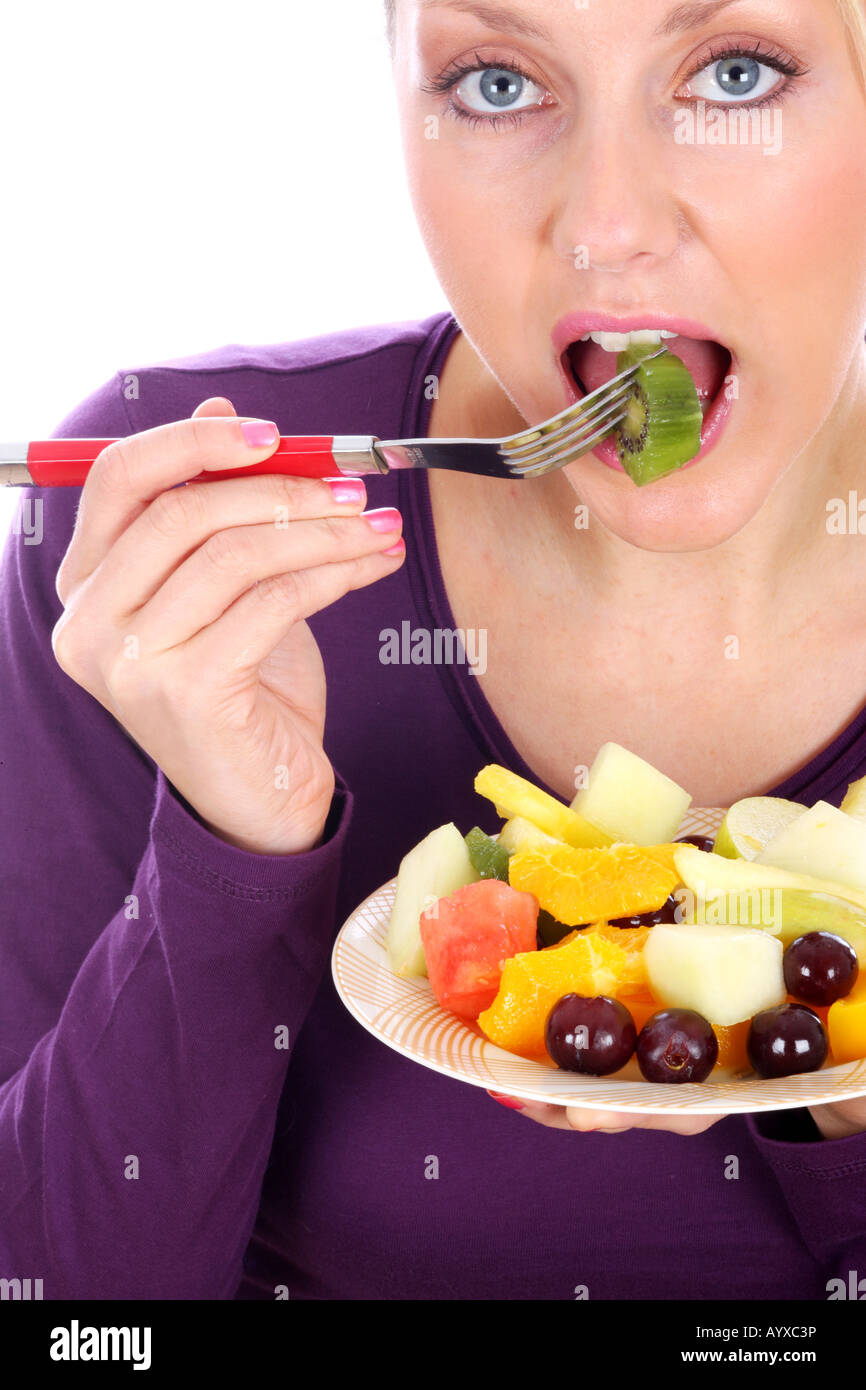 Young Woman Eating Fruit Salad Model Released Stock Photo - Alamy