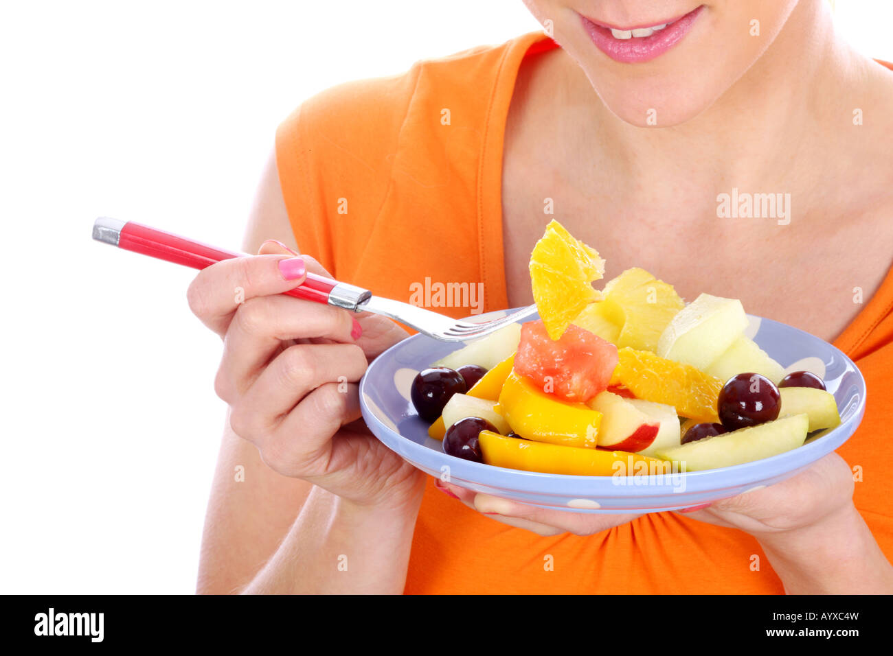 Young Woman Eating Fruit Salad Model Released Stock Photo - Alamy
