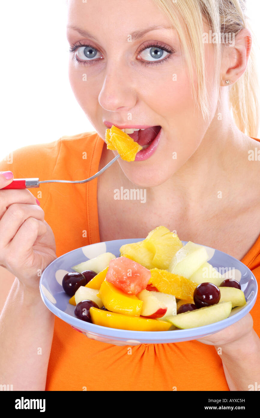 Young Woman Eating Fruit Salad Model Released Stock Photo - Alamy