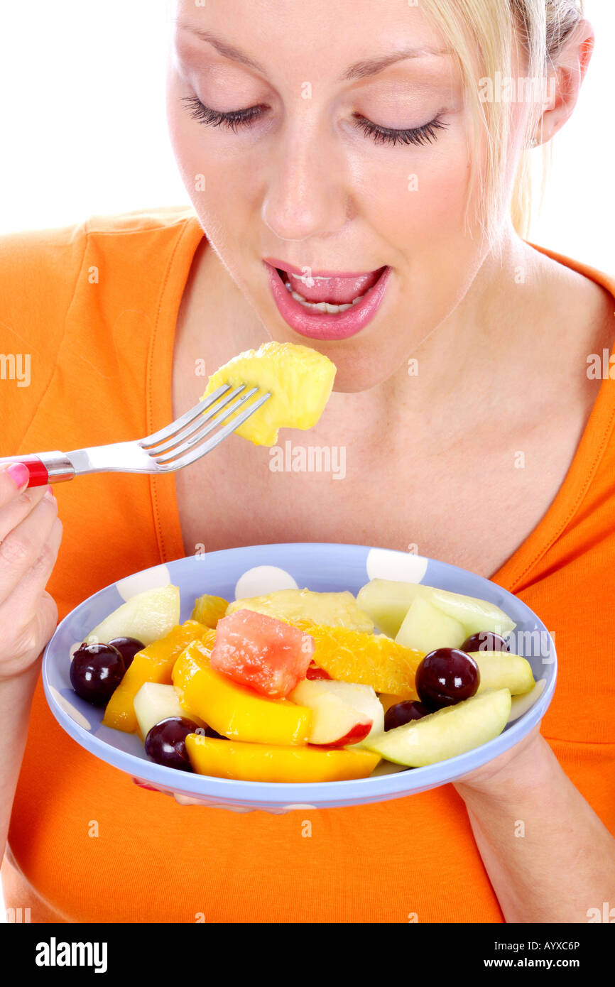 Young Woman Eating Fruit Salad Model Released Stock Photo - Alamy