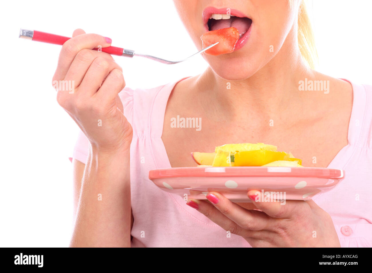 Young Woman Eating Fruit Salad Model Released Stock Photo - Alamy