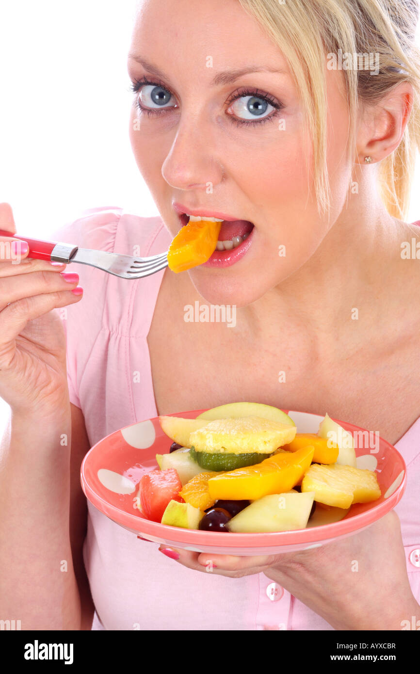 Young Woman Eating Fruit Salad Model Released Stock Photo - Alamy