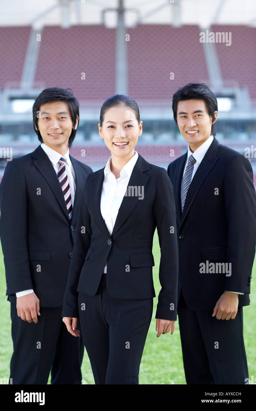 three being smile person in arena Stock Photo - Alamy