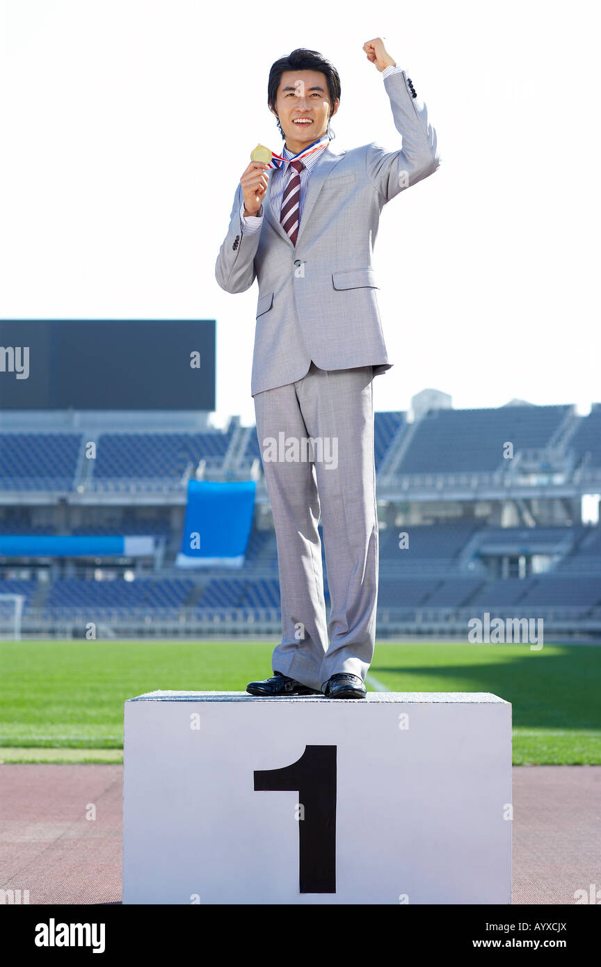a man standing on the platform with hanging medal on the neck Stock ...