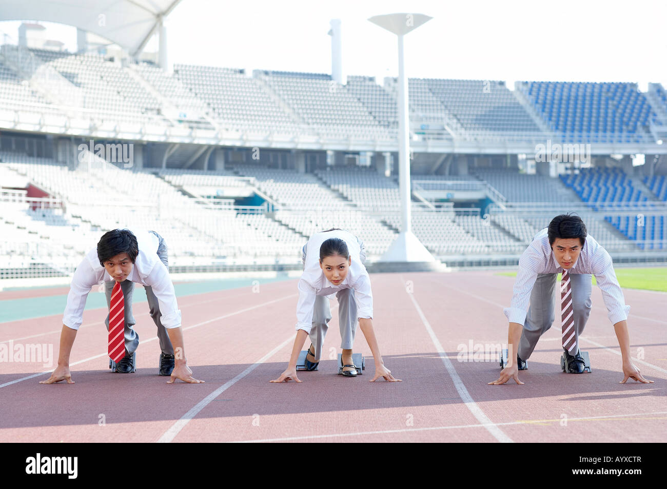 three person is standing at the starting line Stock Photo - Alamy