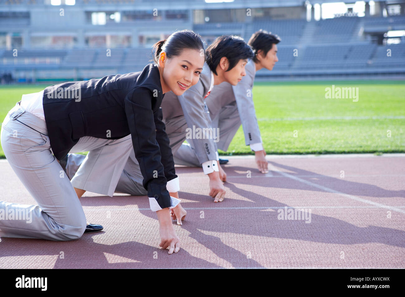 three person are about to start race Stock Photo - Alamy