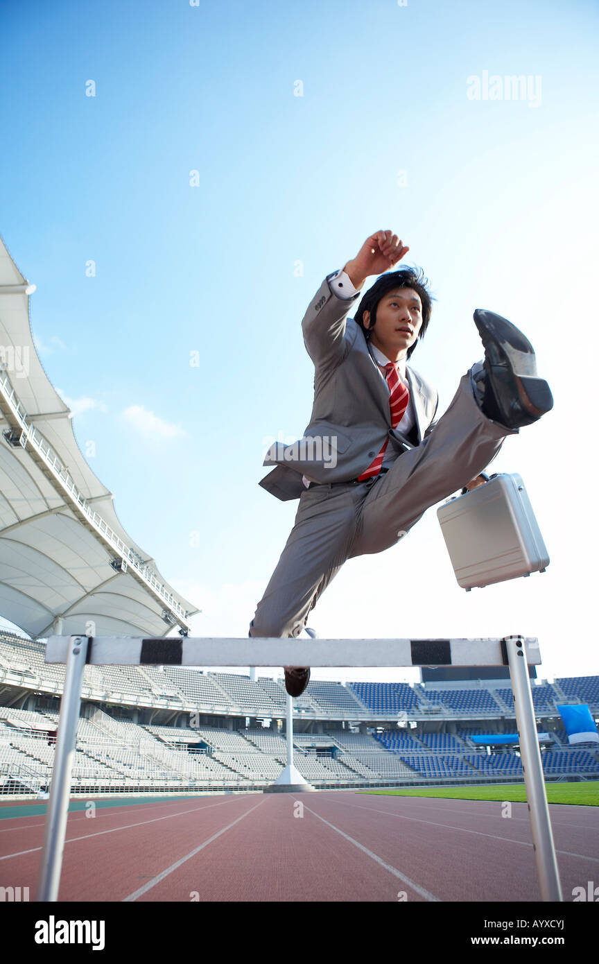 a man running over an obstacle Stock Photo - Alamy