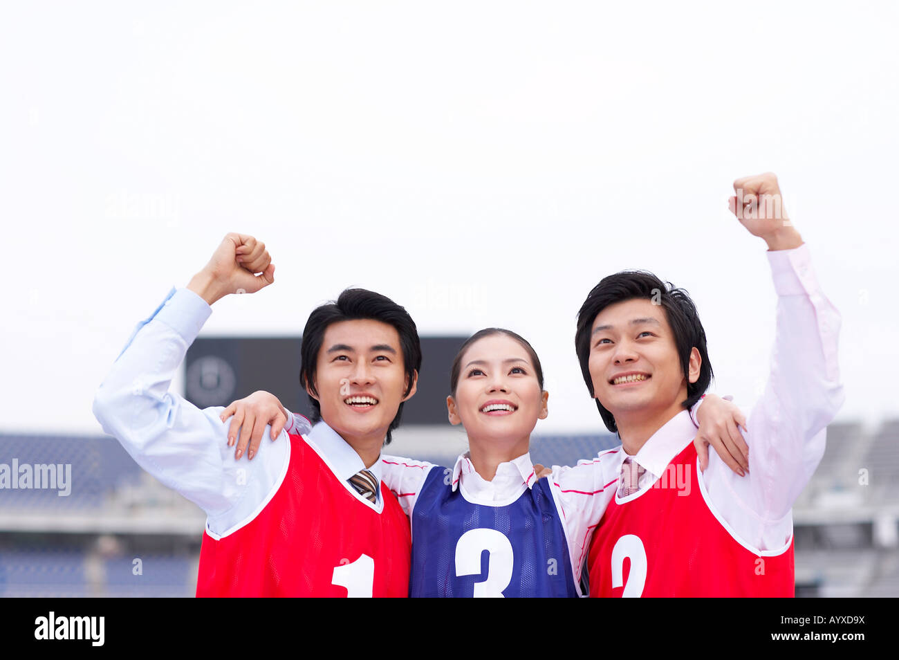 three person wore uniform putting arms around each other´s shoulders ...