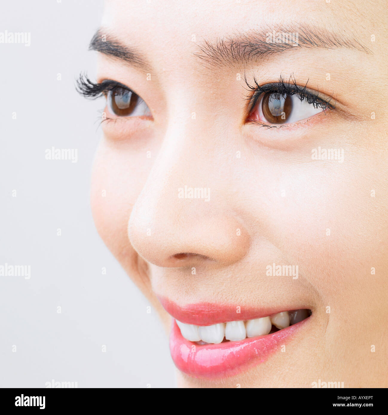 side view of a woman smiling Stock Photo - Alamy