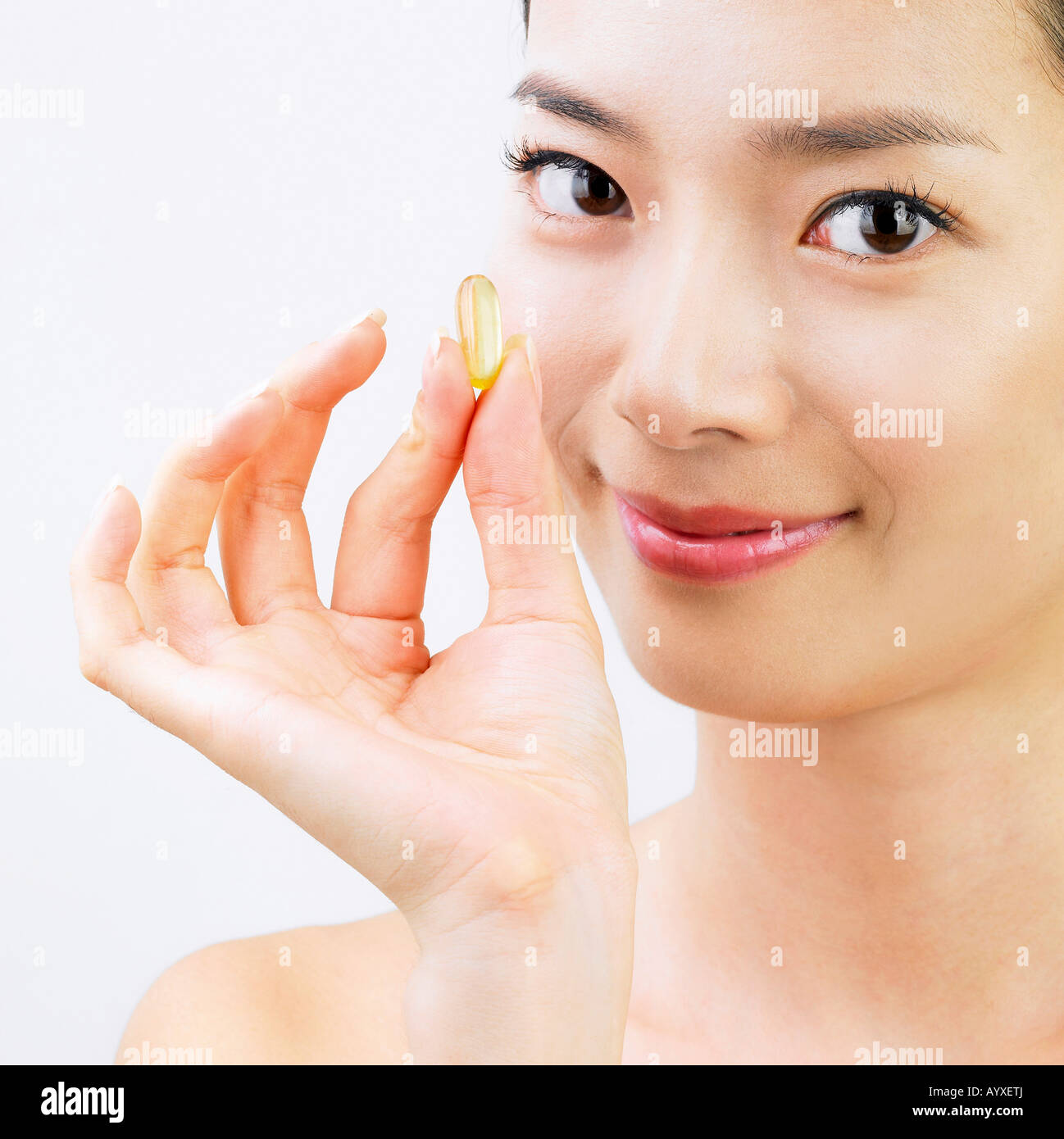 a woman's face holding a tablet Stock Photo - Alamy