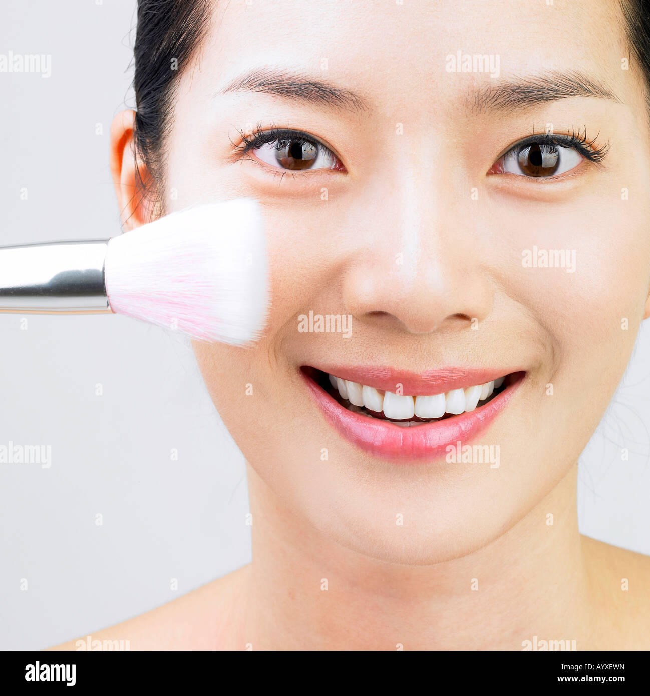 a woman's face put with brush Stock Photo - Alamy